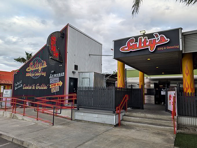 The unassuming exterior of Salty's BBQ proves once again that the best barbecue joints often hide in plain sight, like culinary speakeasies for the smoke-obsessed.