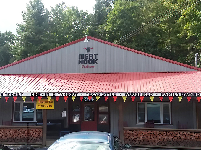 The red BBQ sign stands like a lighthouse for hungry travelers, promising smoky salvation in the Pennsylvania countryside.