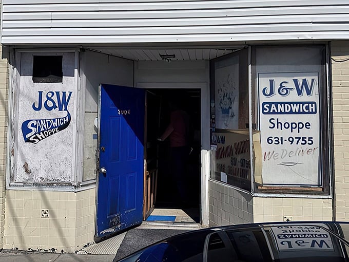 That blue door isn't just an entrance—it's a portal to sandwich nirvana. No fancy signage needed when what's inside speaks volumes.
