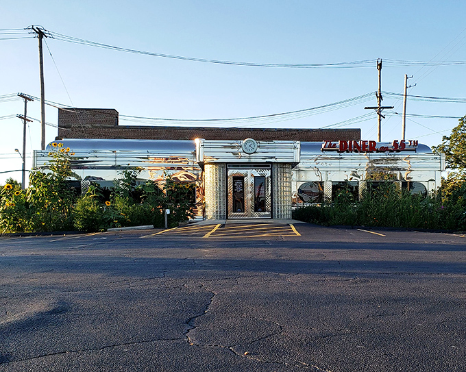 The gleaming stainless steel exterior of The Diner on 55th stands like a time capsule in Cleveland, beckoning hungry travelers with its retro red signage and nostalgic charm.