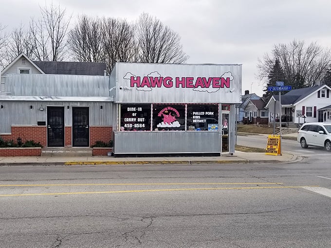 The unassuming exterior of Hawg Heaven stands like a beacon of barbecue hope on Kokomo's Defenbaugh Street, promising smoky delights within its humble walls.