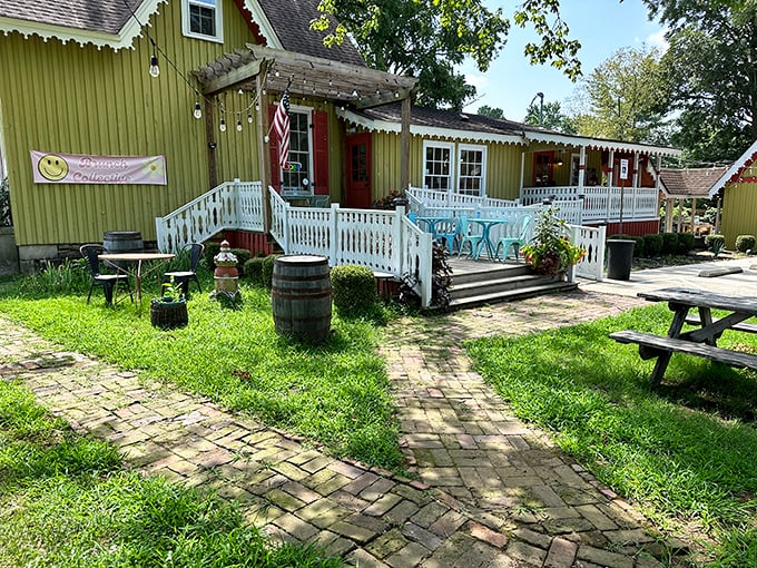 The charming green cottage beckons with its white picket fence and inviting porch—like your favorite aunt's house, if your aunt were a culinary genius.