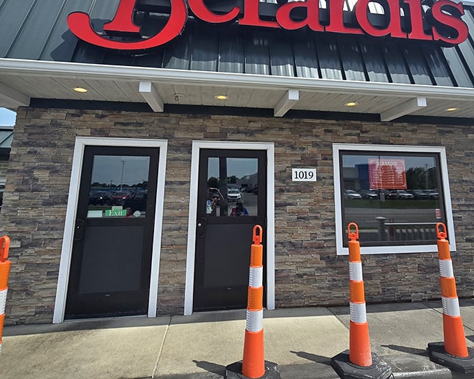 The iconic red Berardi's sign welcomes hungry travelers like a beacon of breakfast hope. Those stone walls have witnessed countless food pilgrimages.
