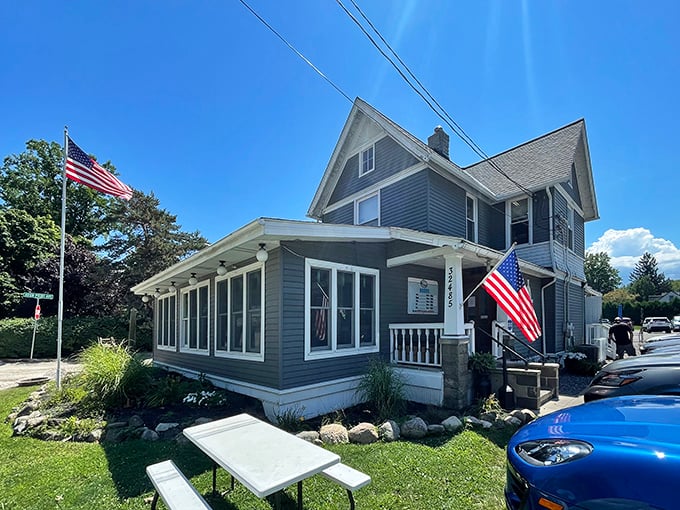 Bathed in daylight, this converted house-turned-restaurant stands proudly with American flags fluttering, like a Norman Rockwell painting come to delicious life.
