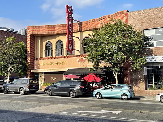 The iconic red vertical sign of Gus's BBQ stands like a beacon of hope for hungry travelers on Fair Oaks Avenue. Southern comfort found in South Pasadena.