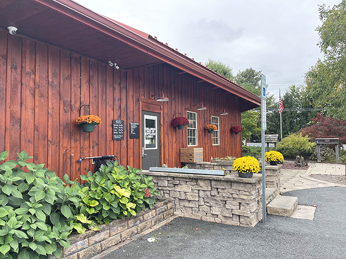 The rustic wooden exterior of Stampede Barbecue welcomes you like an old friend, complete with seasonal flowers that say "come on in, the brisket's ready."