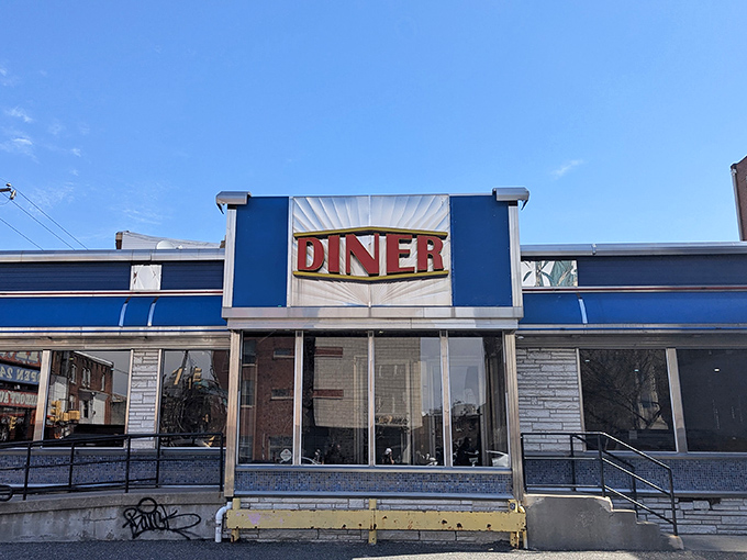 The iconic blue exterior of Broad Street Diner stands as a beacon of breakfast hope on Philadelphia's famous thoroughfare, promising comfort food and nostalgia in equal measure.