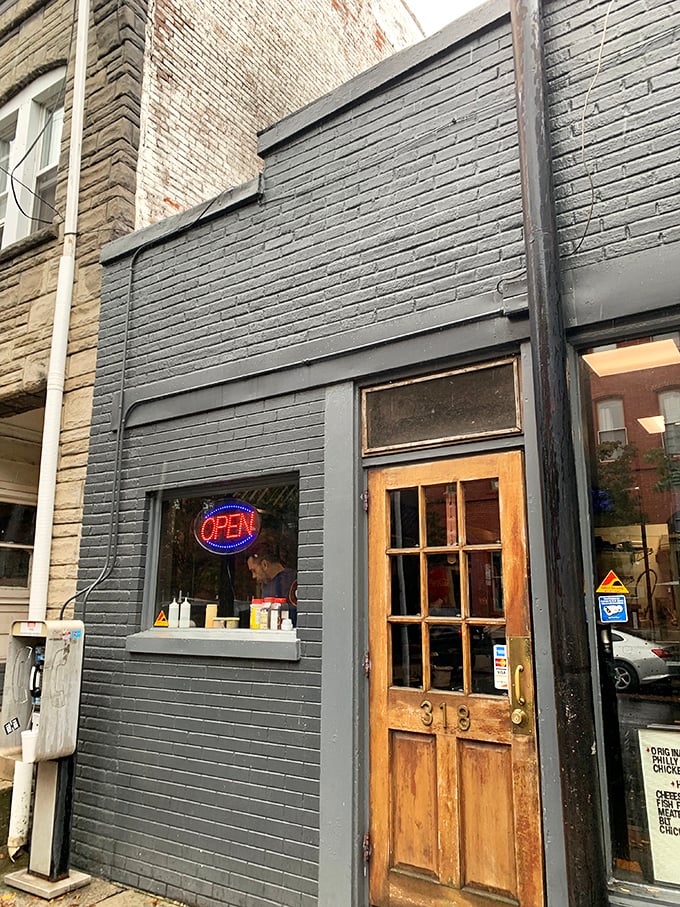 That wooden door with the number 318 isn't just an entrance – it's a portal to cheesesteak nirvana that locals have been keeping to themselves.
