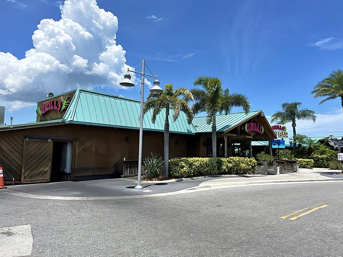 The turquoise roof of Grills gleams under Florida's impossibly blue sky, a beacon for seafood lovers and sunset chasers alike.
