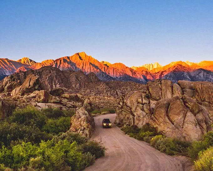 Mother Nature's golden hour masterpiece along the Alabama Hills, where every drive feels like you're starring in your own epic Western.