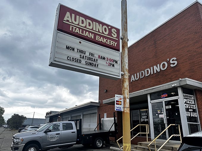 That classic red sign promises Italian baking magic within—operating hours that smart locals have memorized like their own birthdays.