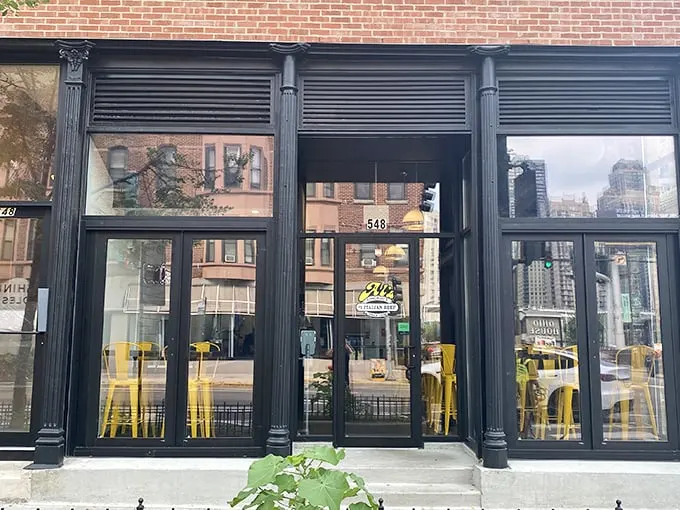 The unassuming storefront on Wells Street hides Chicago's beef royalty behind those sleek black frames and bright yellow chairs – like finding the Hope Diamond in your sock drawer.