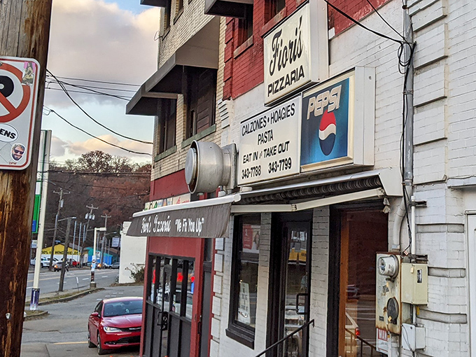 The classic red brick façade of Fiori's Pizzaria stands as a beacon of hope for the pizza-deprived. "We Fix You Up" isn't just a motto—it's a promise.