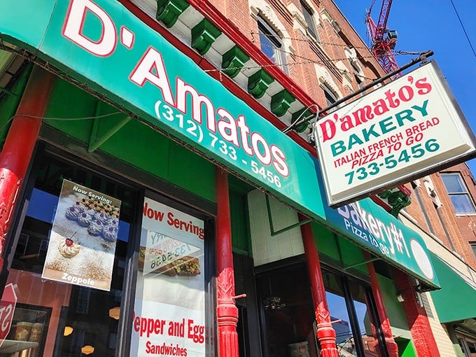 The iconic green and red storefront of D'Amato's Bakery stands as a beacon of Italian culinary tradition in Chicago's West Town neighborhood.