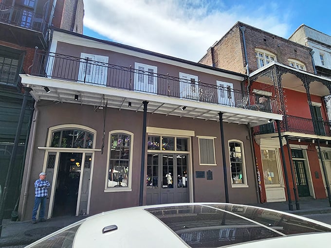 The Gumbo Shop's muted exterior hides culinary treasures like a speakeasy for your taste buds. French Quarter magic awaits.