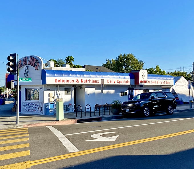 The iconic blue-trimmed exterior of Eat at Joe's stands as a beacon of breakfast hope along Pacific Coast Highway, promising delicious simplicity since 1969.