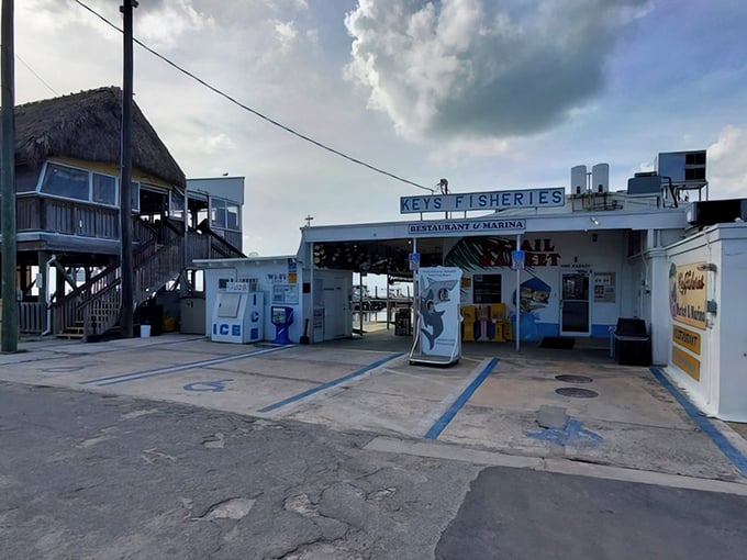 The unassuming entrance to Keys Fisheries stands like a culinary lighthouse, beckoning seafood lovers with promises of ocean-fresh delights in Marathon.