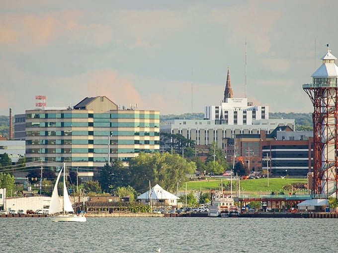 Erie's skyline shimmers along the waterfront, where sailboats glide past modern buildings—affordable lakeside living with a touch of urban sophistication.