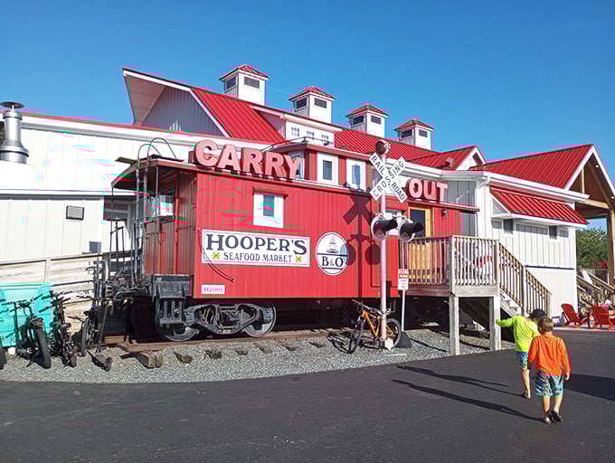 The iconic red caboose at Hooper's isn't just for show—it's a fully functioning carry-out market. Railroad history meets seafood heaven in one perfect Ocean City landmark.