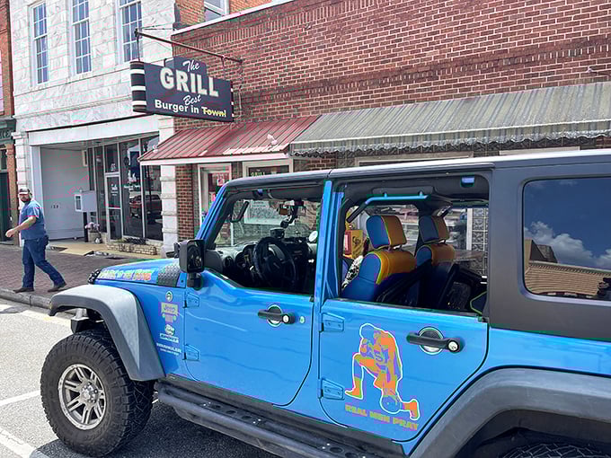 The brick facade and vintage sign of The Grill in Hawkinsville promises what every great roadside find should: the "Best Burger in Town" isn't just a claim—it's a mission statement.