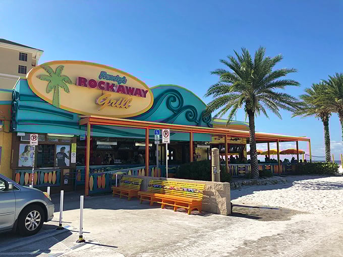 The beachfront beacon of Frenchy's Rockaway Grill welcomes hungry travelers with its vibrant colors and promise of seafood paradise just steps from Clearwater's famous white sands.
