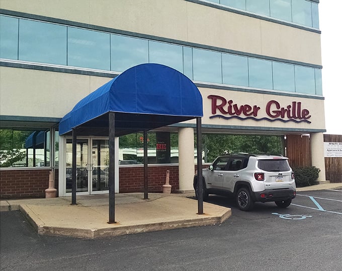 A blue awning welcomes you to River Grille, where Pennsylvania comfort meets culinary craft in the heart of Wilkes-Barre.