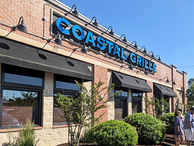 The iconic blue sign of Coastal Grille stands out against Wyomissing's brick landscape like a beacon for seafood lovers everywhere.