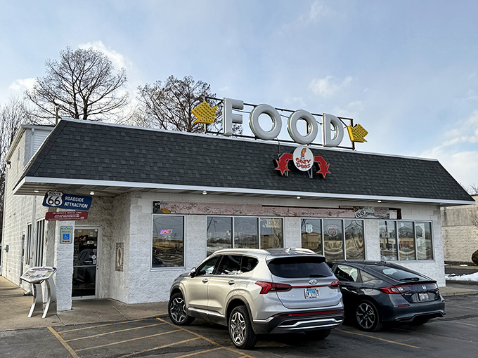The humble roadside exterior of Cozy Dog Drive In belies its legendary status. This unassuming building on Route 66 has been making Illinois stomachs happy for generations.