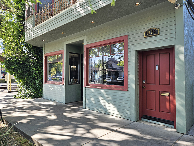 The mint-green exterior with burgundy trim isn't just charming—it's a portal to barbecue nirvana hiding in plain sight on Sacramento's J Street.