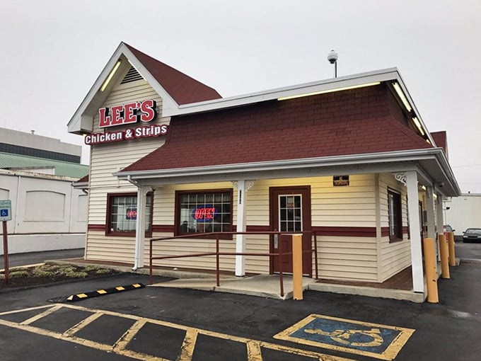 The red-roofed beacon of chicken perfection stands proudly on the corner, promising comfort food that delivers on its "Famous Recipe" claim.