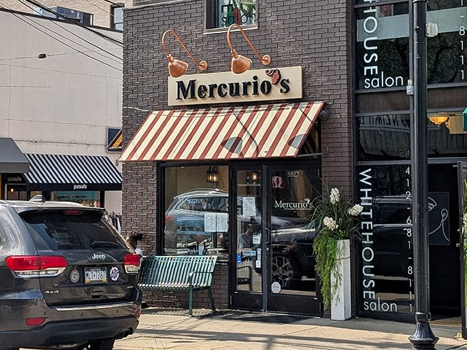The charming storefront of Mercurio's beckons pizza pilgrims with its distinctive red and white awning—like a wink from Italy on a Pittsburgh street corner.