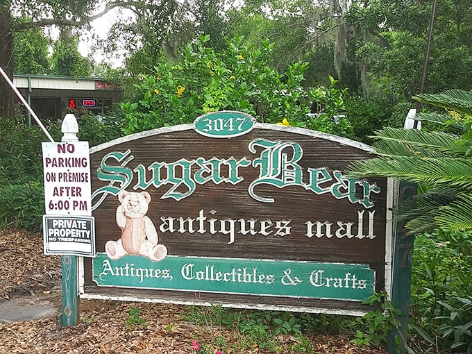 The weathered green sign against Jacksonville's blue sky hints at treasures within – like discovering a portal to the past hiding in plain sight.