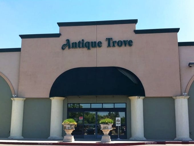 The unassuming facade of Antique Trove belies the wonderland within, like a treasure chest disguised as a suburban building.