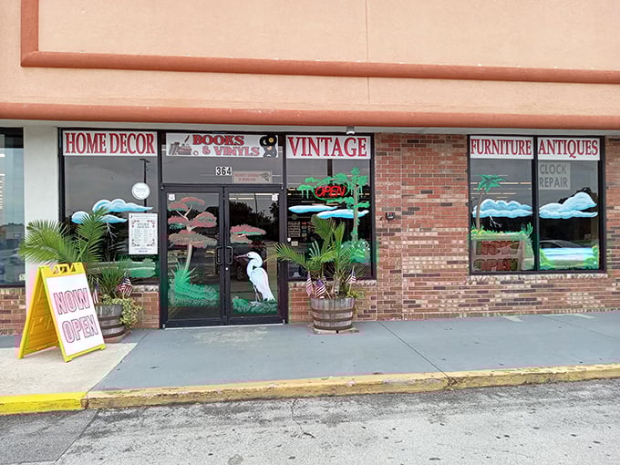 The coral-colored exterior of Wildwood Antique Mall stands as a beacon for treasure hunters, complete with its nostalgic horse and carriage silhouette.