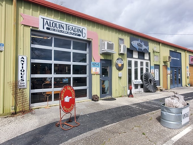 The colorful exterior of Talquin Trading Co. beckons with its vibrant purple foundation and rustic covered porch—Florida's answer to treasure hunting without a metal detector.