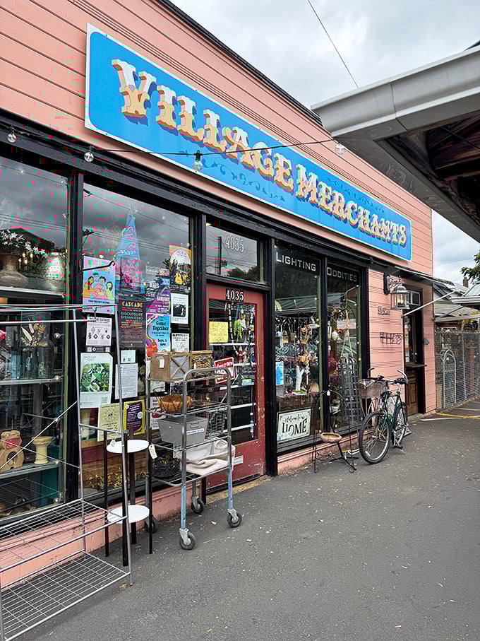 The salmon-pink exterior with its bold blue signage promises treasures within – like a wink from Portland's quirky soul to passing bargain hunters.
