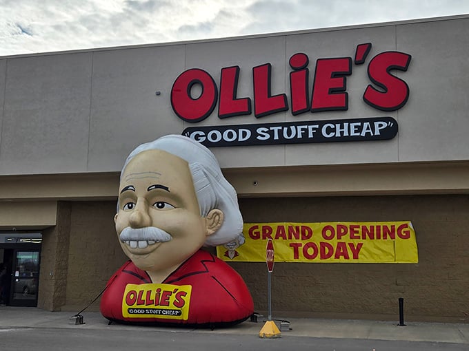 The smiling mascot outside Ollie's isn't just welcoming shoppers—it's practically announcing "your wallet is about to have a very good day!"