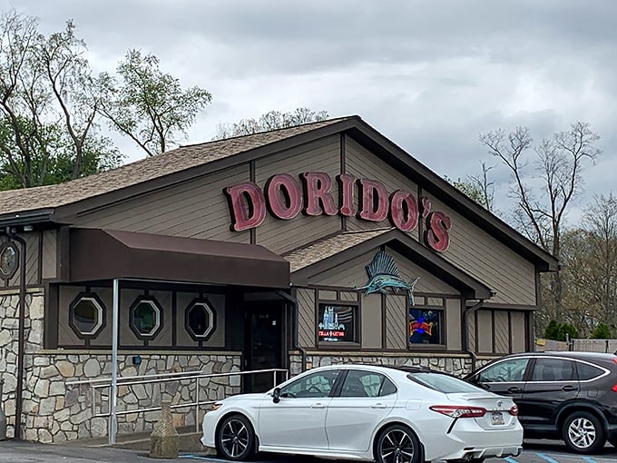The stone-and-wood exterior of Dorido's stands like a sentry guarding Pittsburgh's seafood secrets, complete with nautical portholes that hint at treasures within.