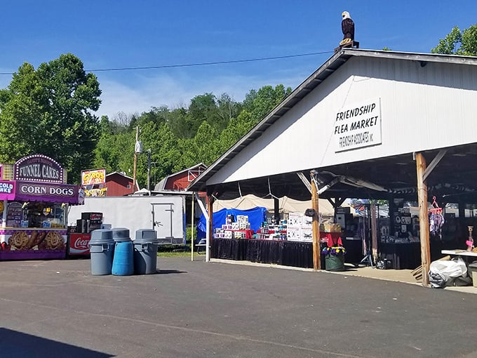 The main entrance to Friendship Flea Market stands proudly under Indiana's blue sky, with food stalls promising corn dogs and funnel cakes that'll make your diet cry uncle.