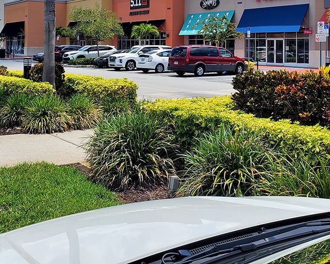 The Loop's meticulously landscaped exterior isn't just pretty—it's the first sign you've entered a shopping oasis where your wallet can actually relax.
