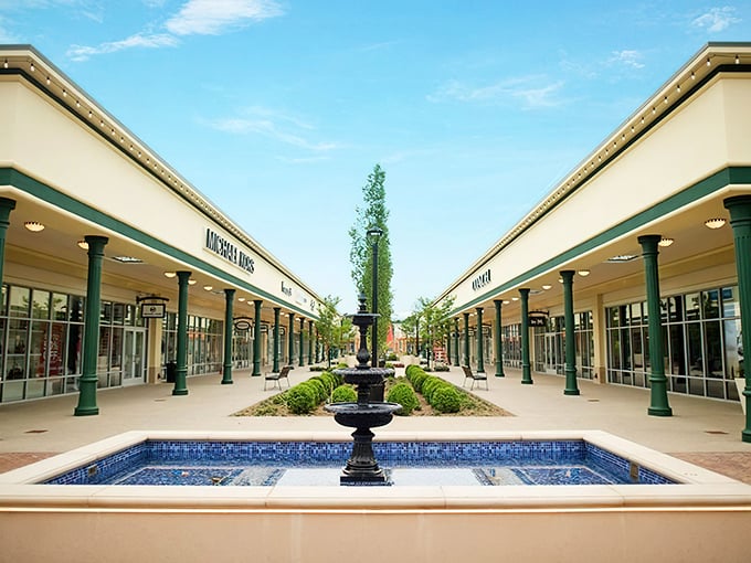 The symmetrical storefronts of Tanger Outlets create a retail runway that beckons shoppers like a siren song to sailors with credit cards.