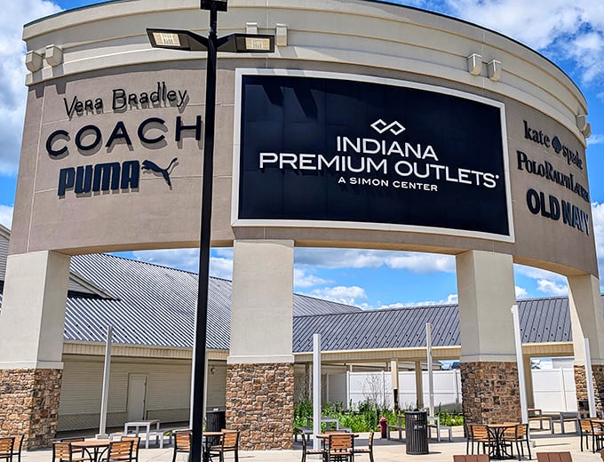 The retail promised land beckons with its stone-and-stucco facade, where Coach, Vera Bradley, and Kate Spade tempt even the most budget-conscious shoppers.