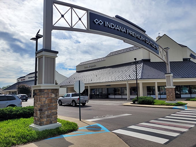 Welcome to bargain paradise! The iconic entrance to Indiana Premium Outlets stands ready to transform your shopping experience and rescue your budget from retail despair.