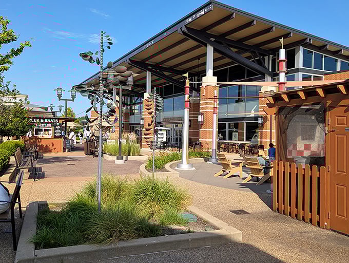 The central courtyard area offers a moment of respite between shopping conquests, complete with whimsical sculptures and comfortable seating for the shopping-weary.