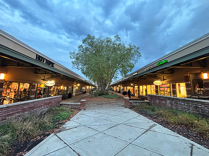 The twilight shopping hour at Grove City Premium Outlets, where storefronts beckon like old friends with promises of "just one more deal."