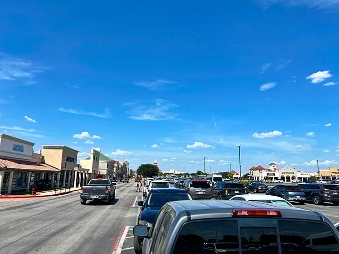 The parking lot pilgrimage begins! A sea of vehicles under that big Texas sky signals you're about to join fellow bargain hunters on sacred ground.