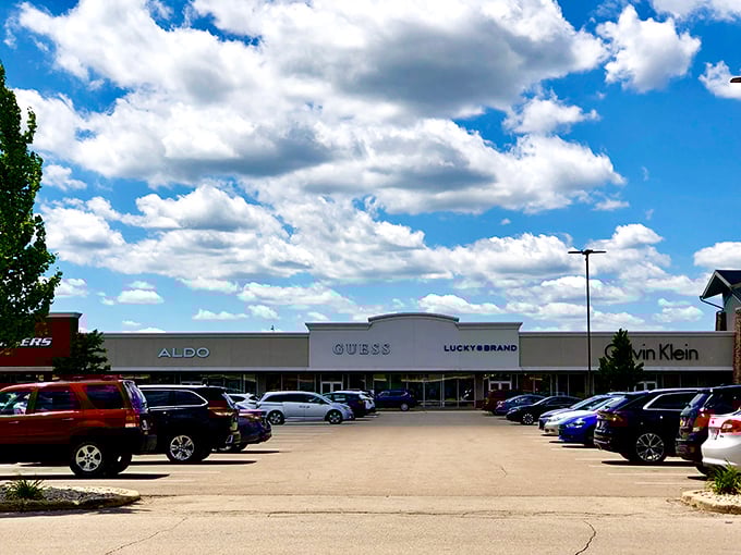 Blue skies and big brands – the GUESS, ALDO, and Calvin Klein storefronts stand ready for your wallet's workout session.