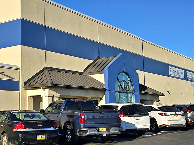The distinctive blue and cream exterior of Re-Uzit Shop beckons like a retail oasis in New Holland, where second chances and first-rate finds await.