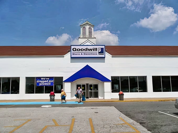 The blue-trimmed entrance beckons like a portal to possibility—where fashion finds and home treasures await under that distinctive Goodwill sign.