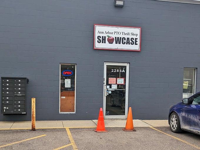 The unassuming gray exterior with its bright red-framed apple logo promises treasures within—like finding a diamond mine disguised as a garden shed.